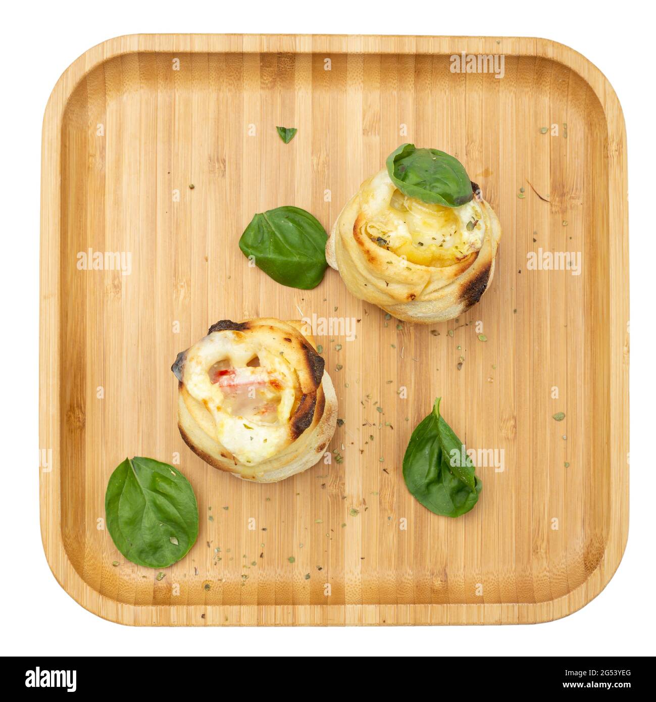 Pizzetti on a wooden plate. Variety of pizza isolated on white ...