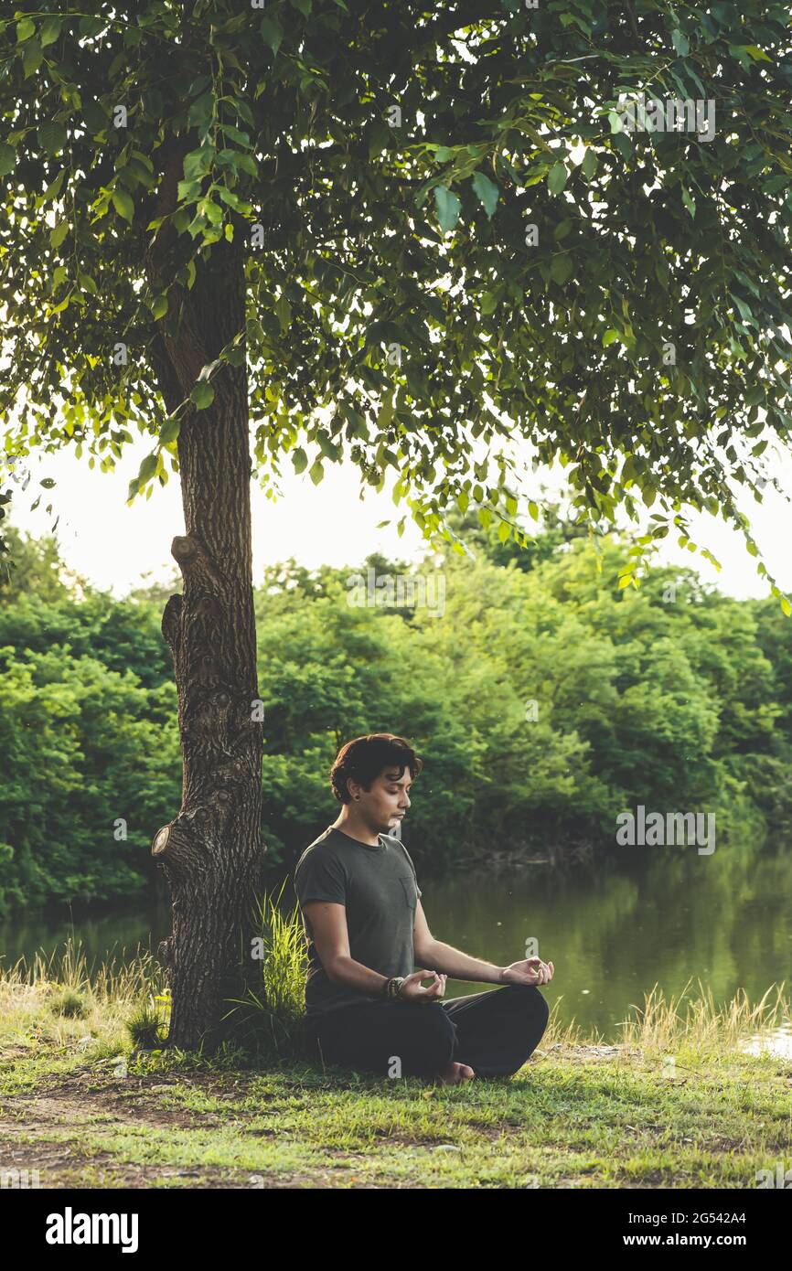 Person meditating in nature hi-res stock photography and images - Alamy