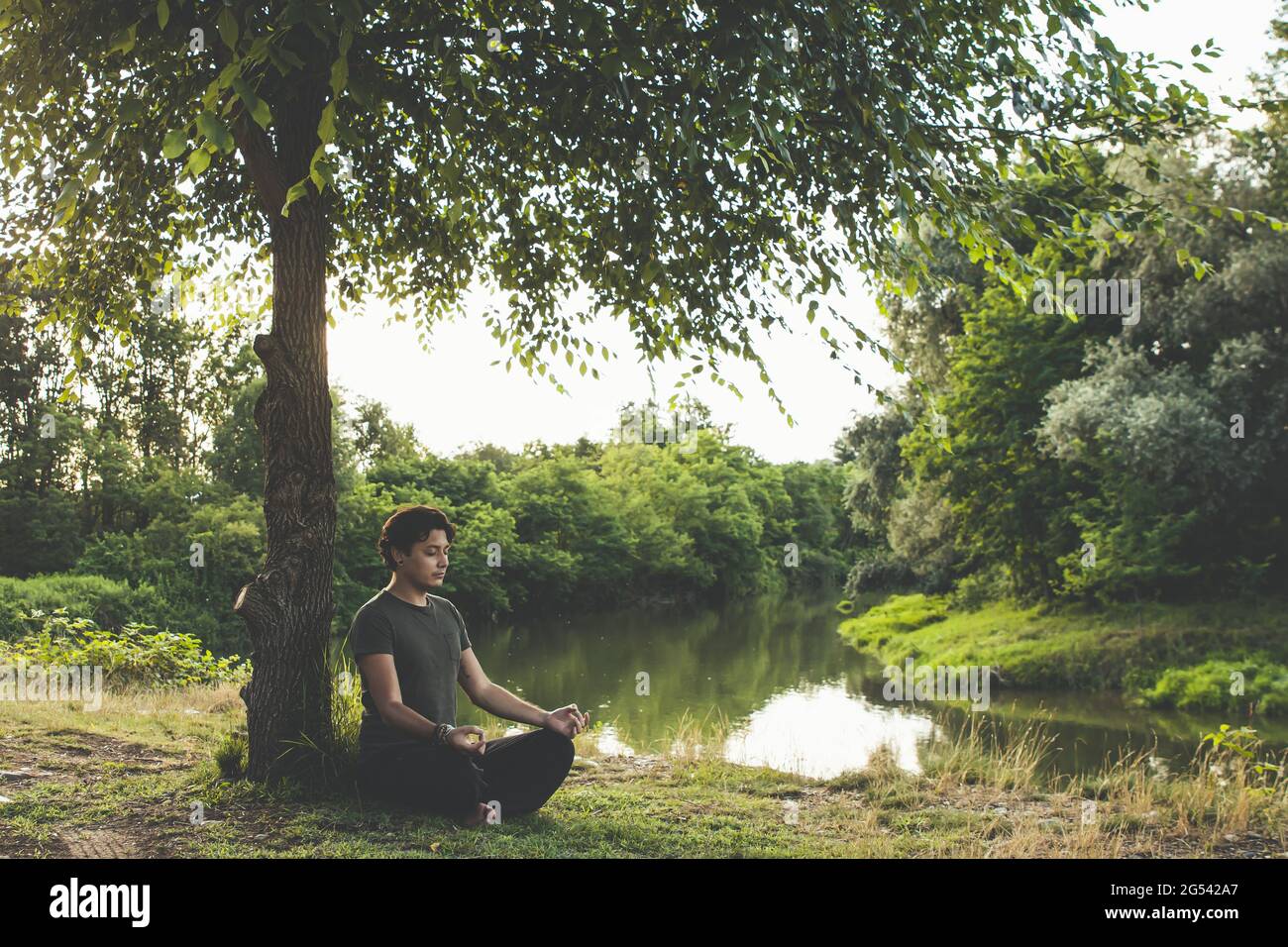 Person meditating in nature hi-res stock photography and images - Alamy