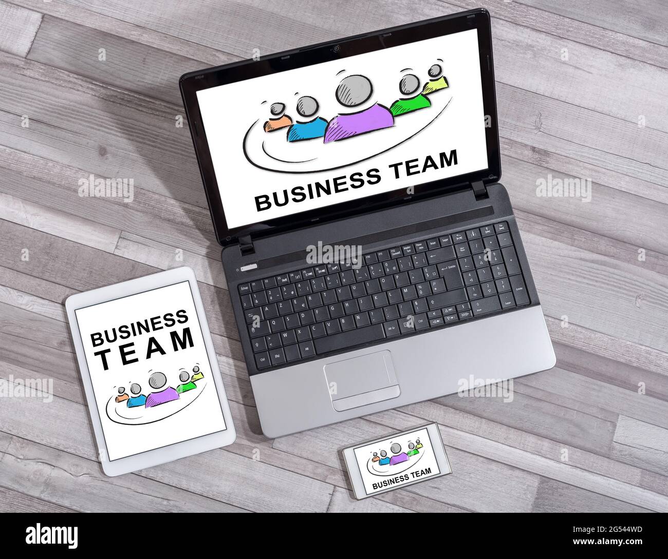 Business team concept shown on different information technology devices ...
