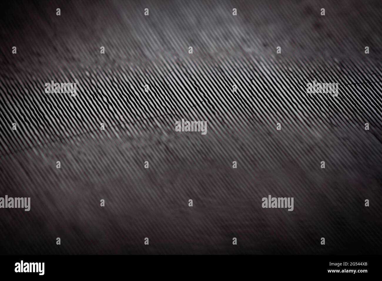Macro shot of black vinyl record showing scratches. Surface of an old ...