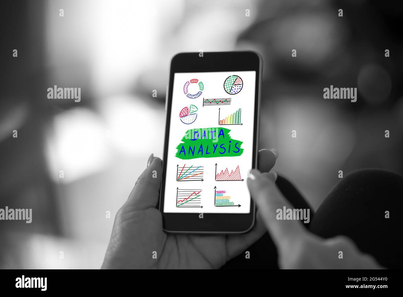 Hand holding a smartphone with data analysis concept Stock Photo - Alamy