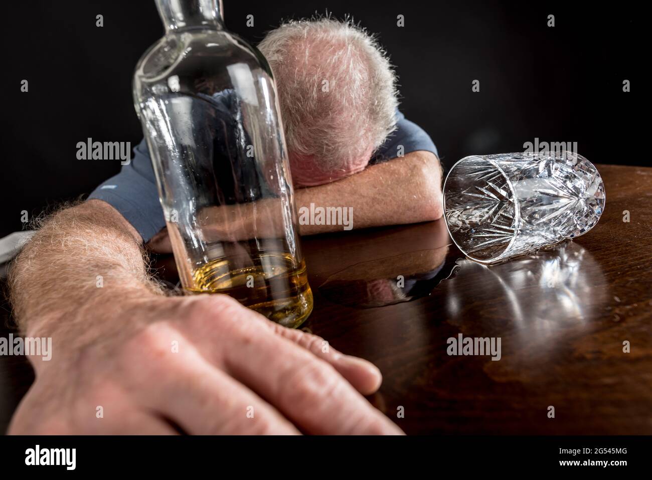 Slumped at table hi-res stock photography and images - Alamy