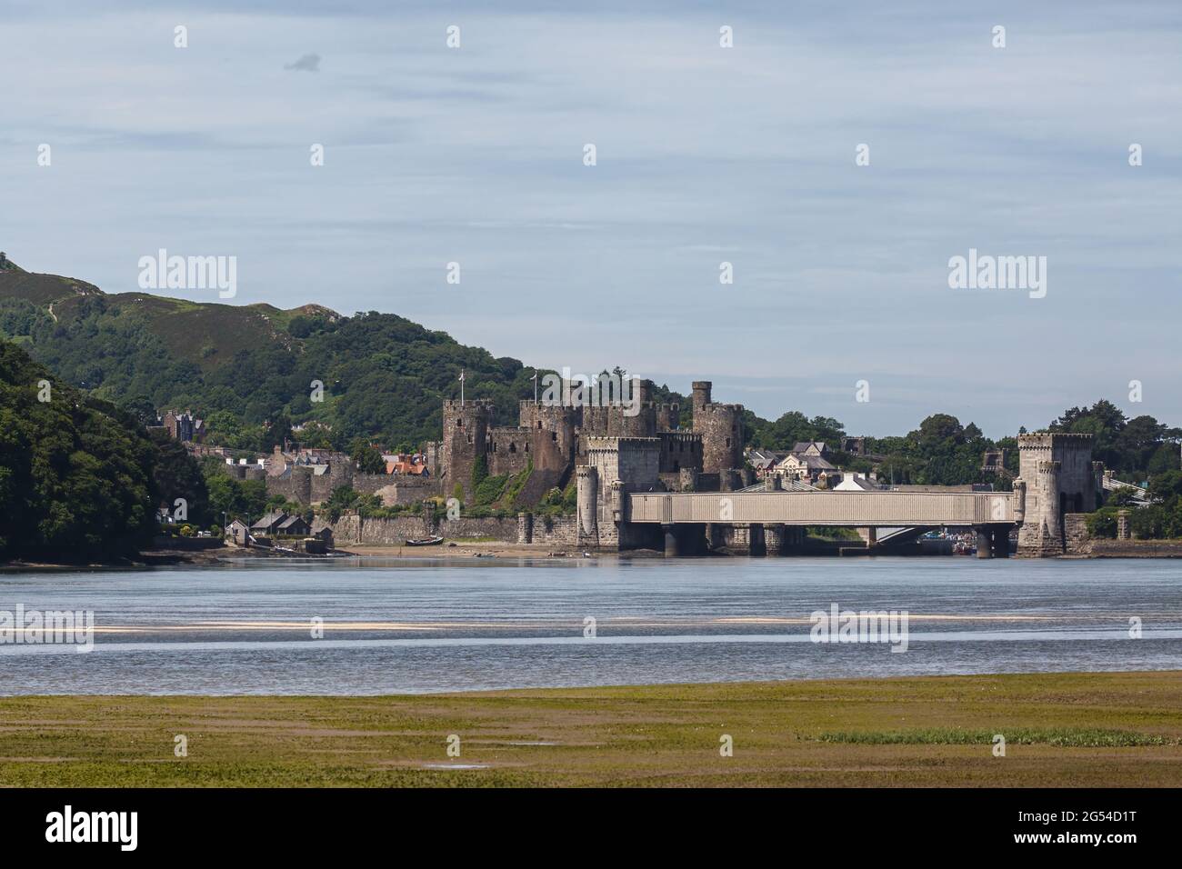 Looking across the River Conwy at Conwy Castle with the metal train ...