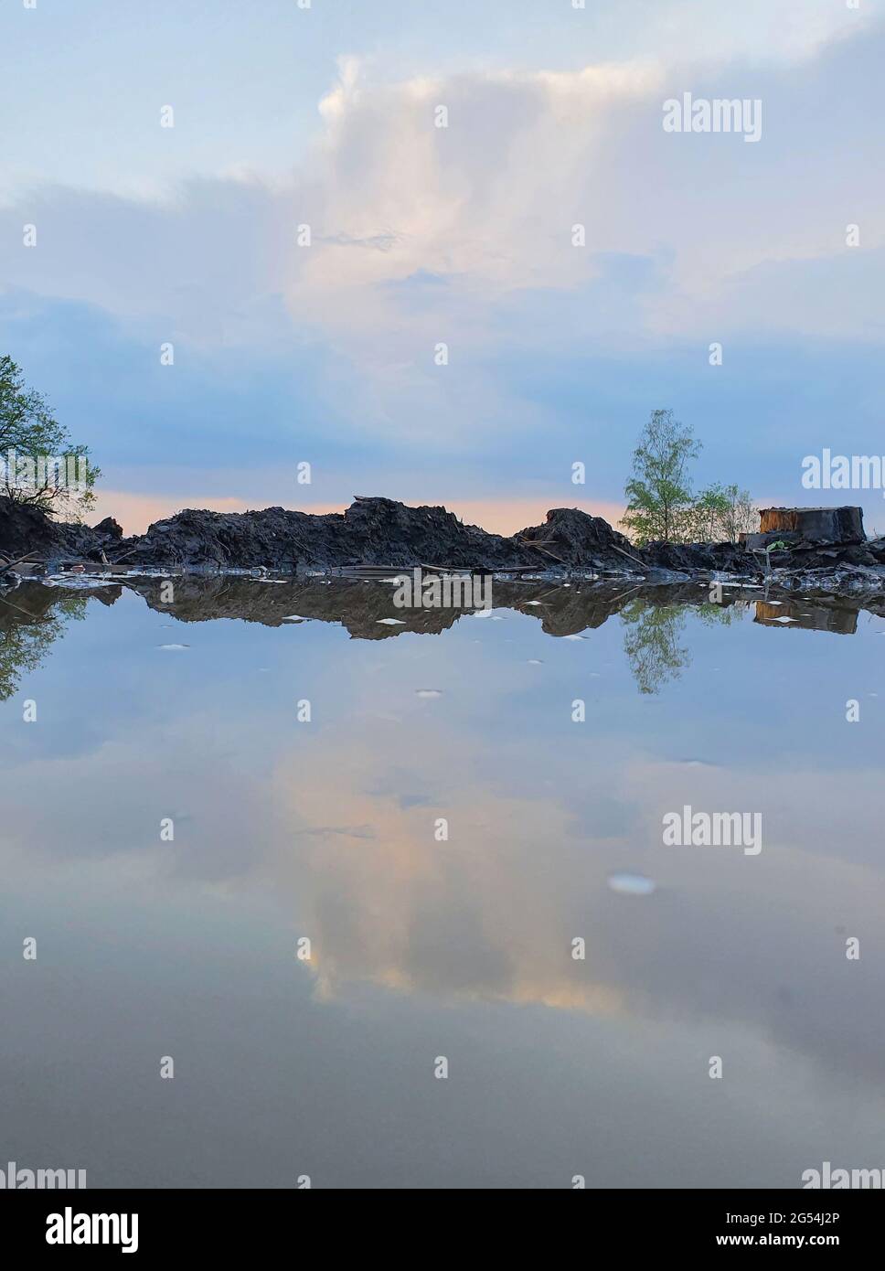 Reflection in a rain paddle Stock Photo - Alamy