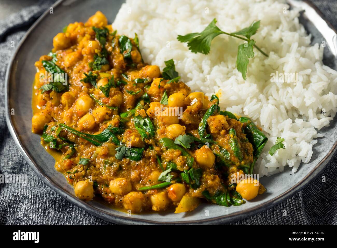Homemade Chickpea and Spinach Curry with White Rice Stock Photo - Alamy
