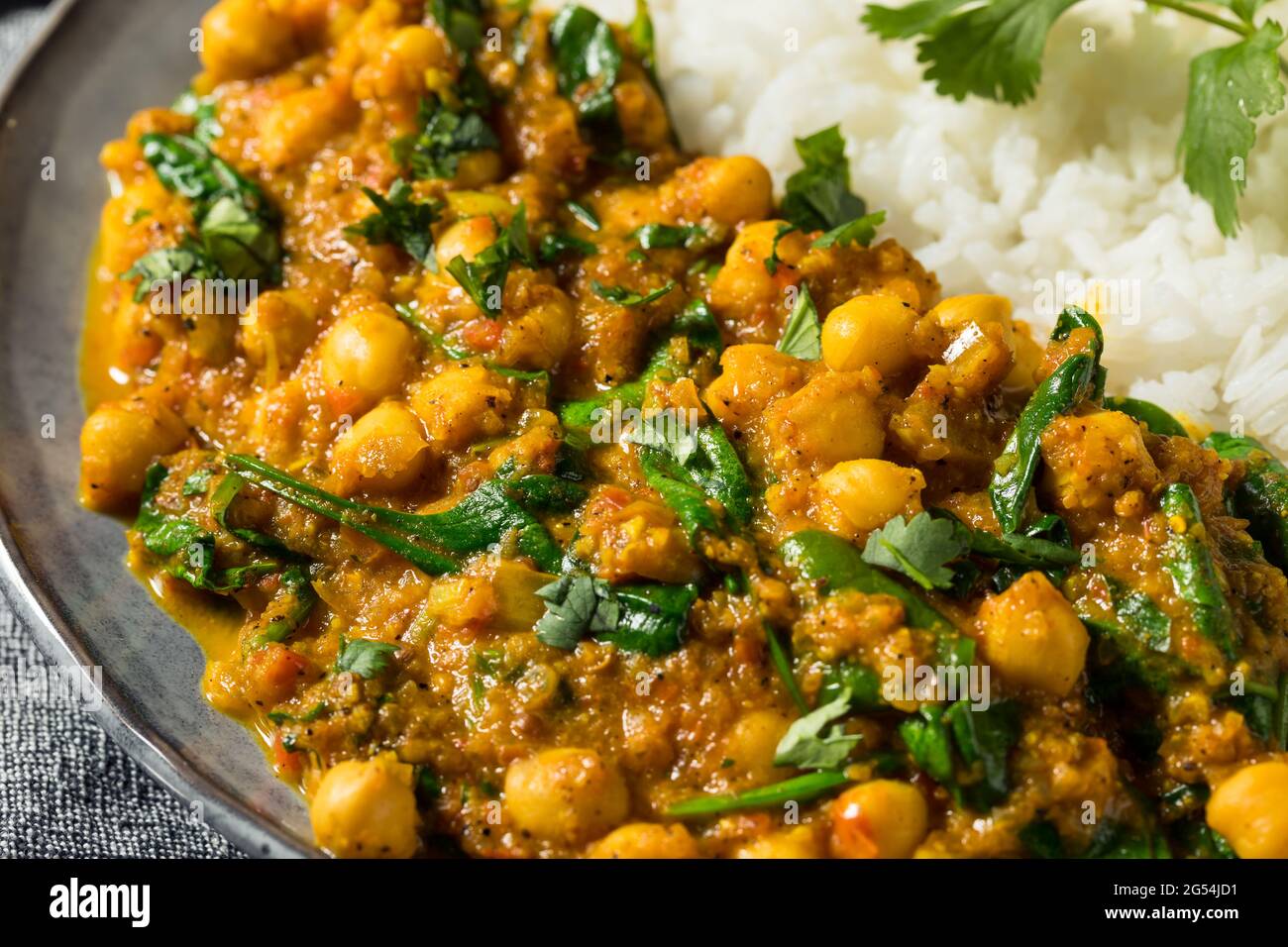 Homemade Chickpea and Spinach Curry with White Rice Stock Photo - Alamy