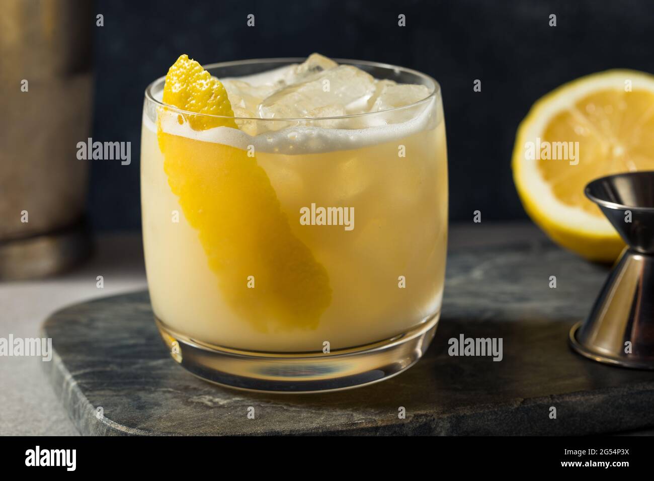 Boozy Refreshing Scotch Sour with Lemon and Syrup Stock Photo - Alamy