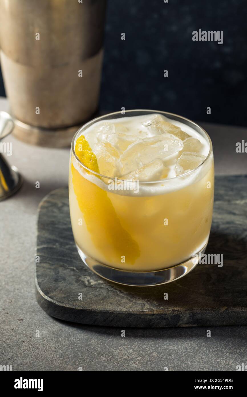 Boozy Refreshing Scotch Sour with Lemon and Syrup Stock Photo - Alamy