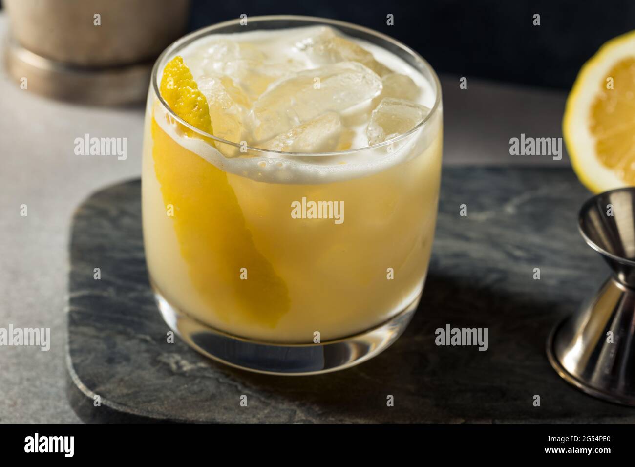 Boozy Refreshing Scotch Sour with Lemon and Syrup Stock Photo - Alamy