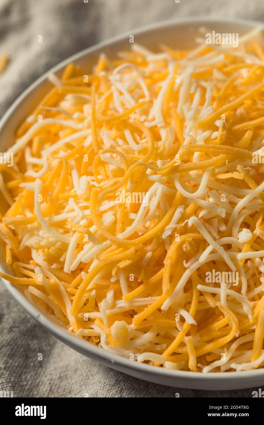 Organic Shredded Mexican Cheese Mix in a Bowl Stock Photo - Alamy