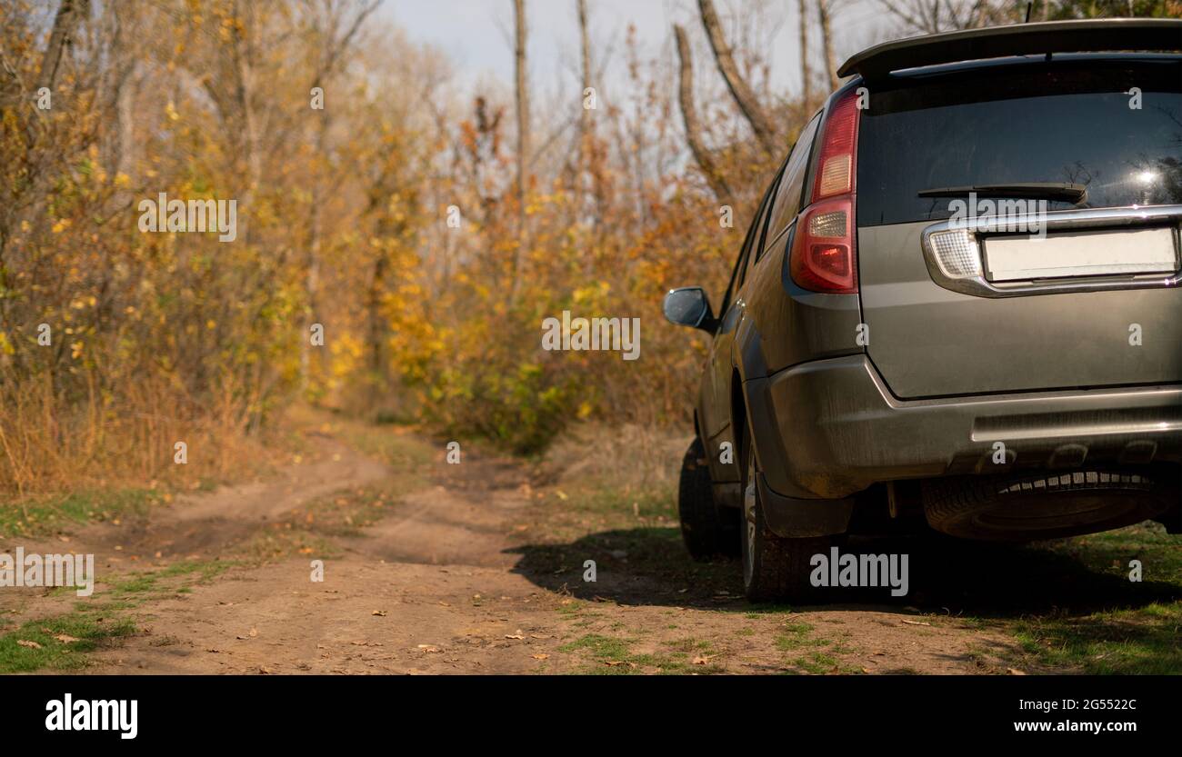 outdoor 4wd off-road big car stop near the road in forest landscape ...