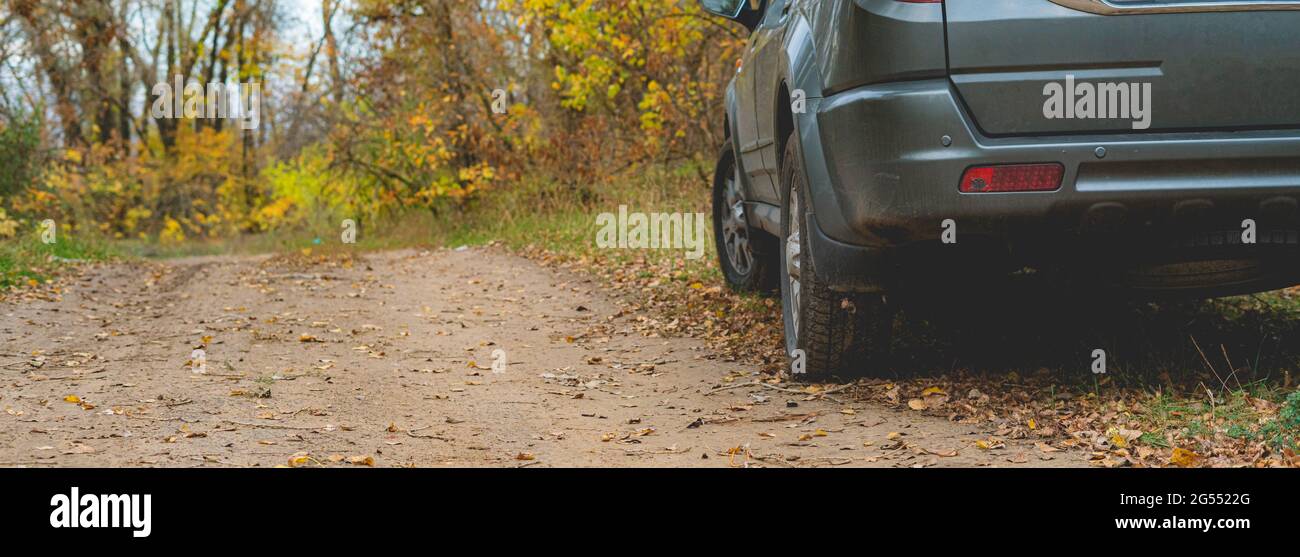 outdoor 4wd off-road big car stop near the road in forest landscape ...