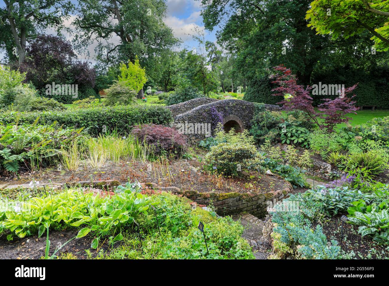 A flint Stone bridge in the grounds of Bressingham Gardens, a steam ...