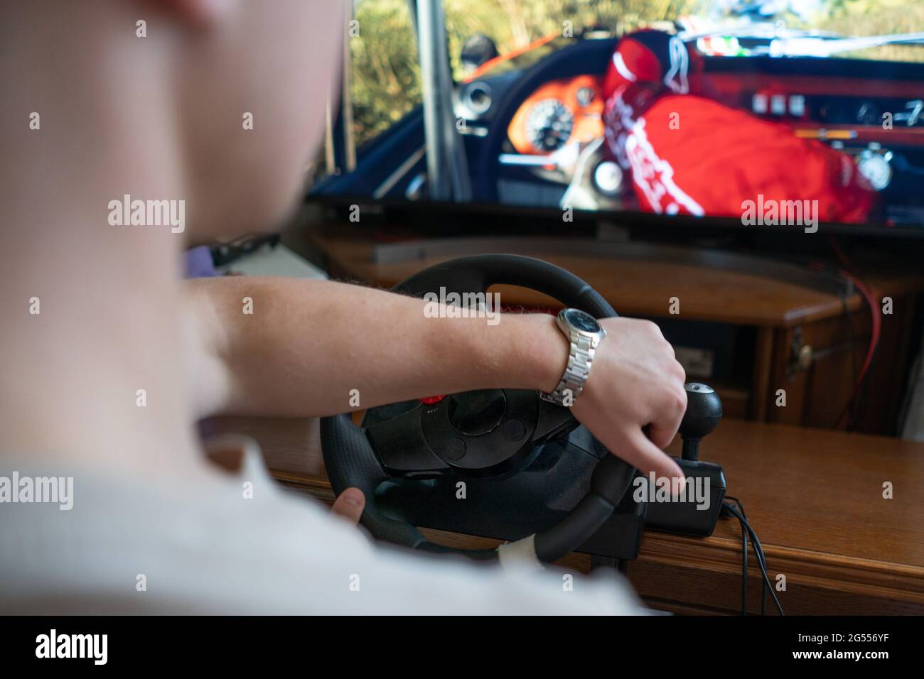 man learns how to drive the car on the virtual driving auto simulator ...