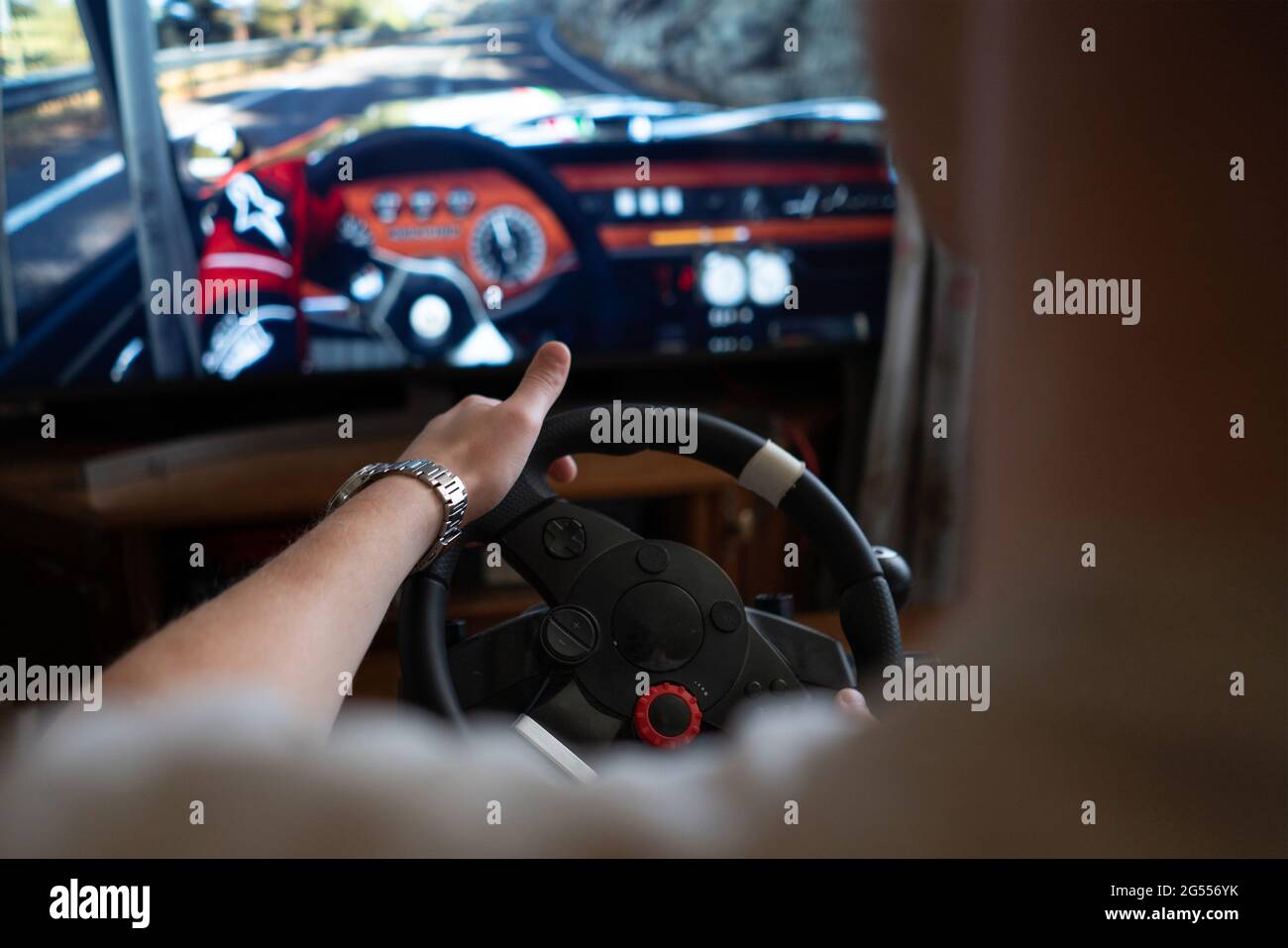 man learns how to drive the car on the virtual driving auto simulator ...