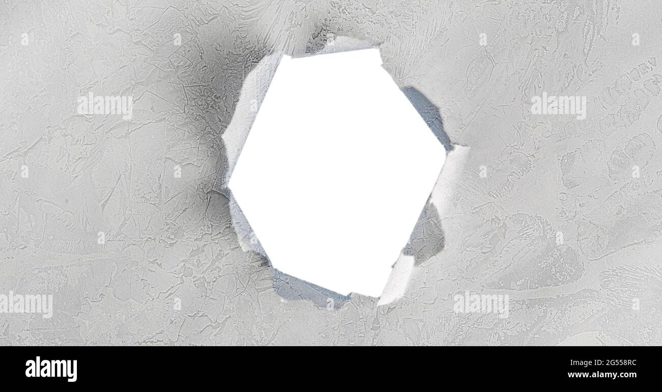 isolated piece of paper with a torn, cracked hole on it, copy space ...