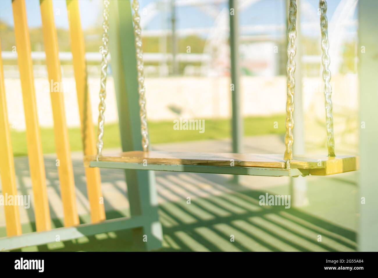 the empty swing seat on the children playground as the symbol of ...