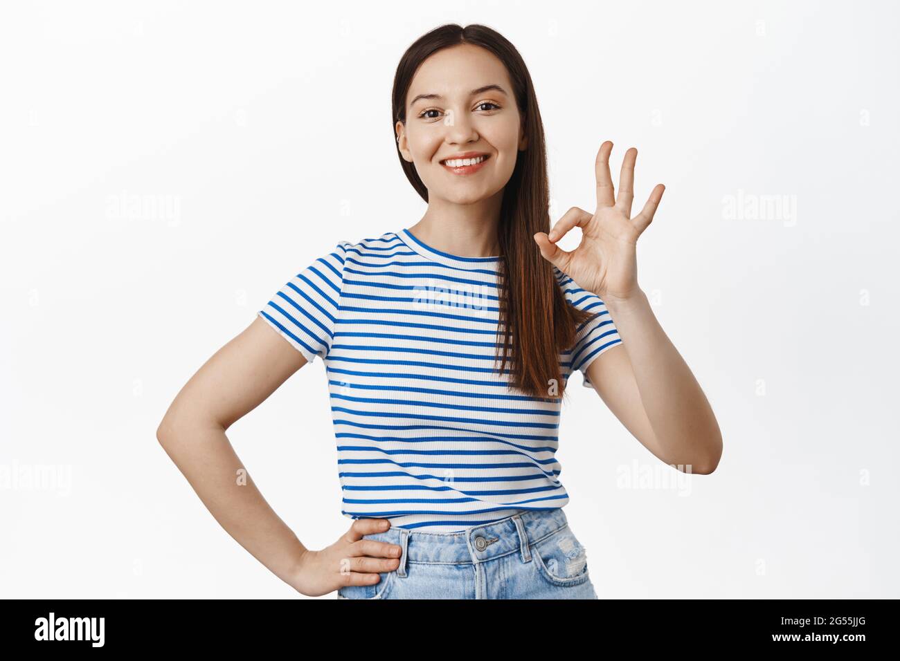 Zero problems. Smiling satisfied girl, 20s woman showing okay, OK sign ...