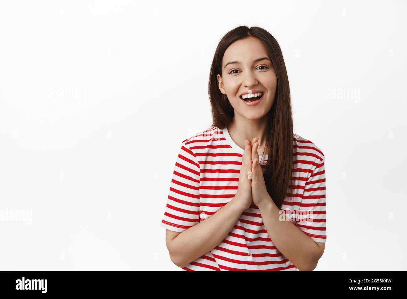 Thank you. Smiling friendly and peaceful girl, hold hands in pray ...