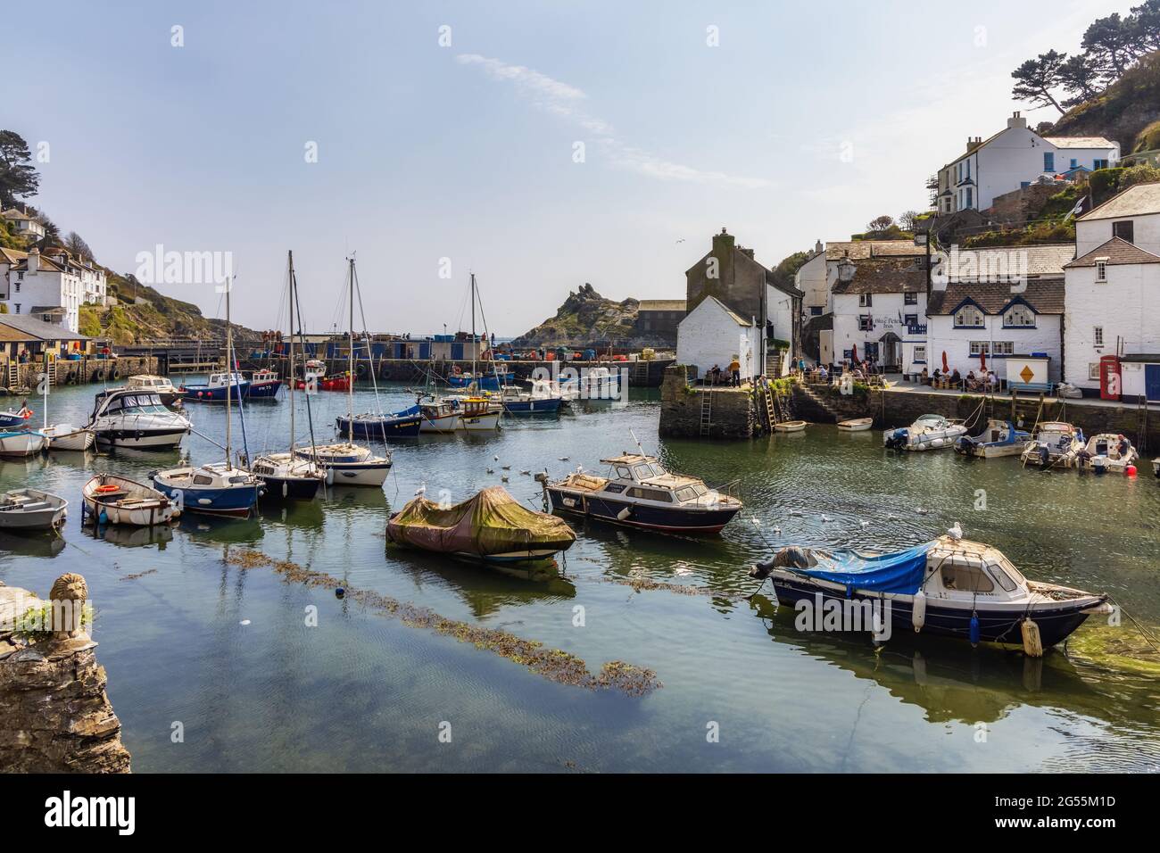 Boats moored in the inner harbour at Polperro, a charming and ...