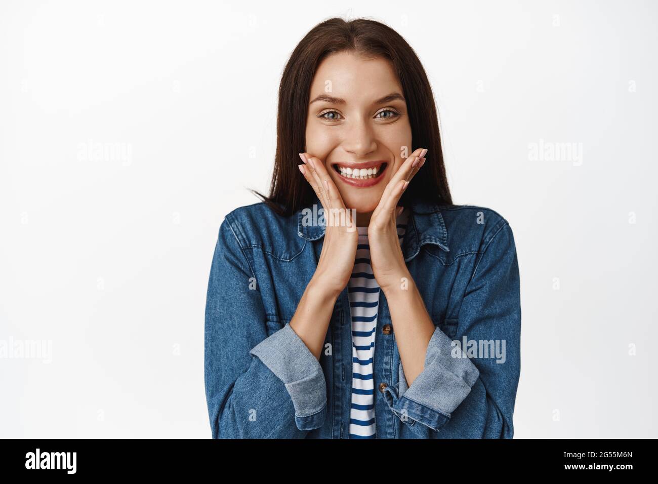 Close up of extremely happy adult woman, smiling white teeth, touching ...