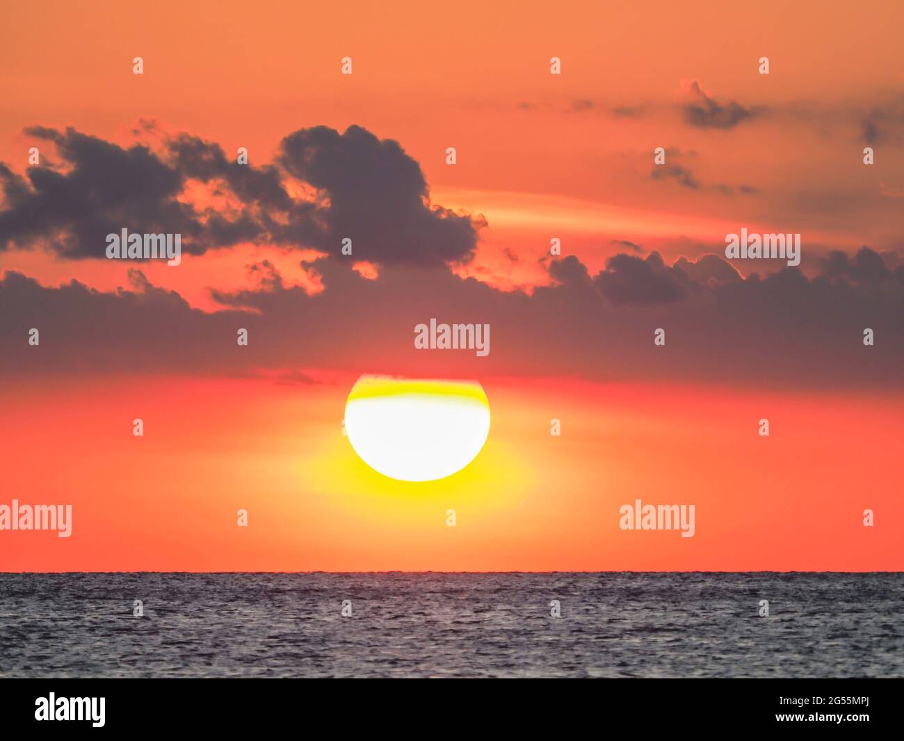 Sun in orange sky at sunset over the Gulf of Mexico off Venice, Florida ...