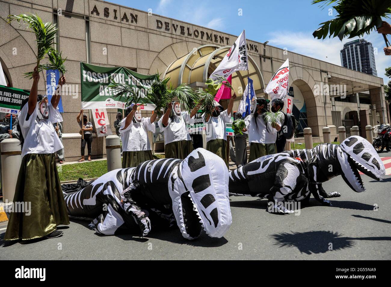 Climate Activists Dressed In Costumes And Dinosaur Fossils Perform