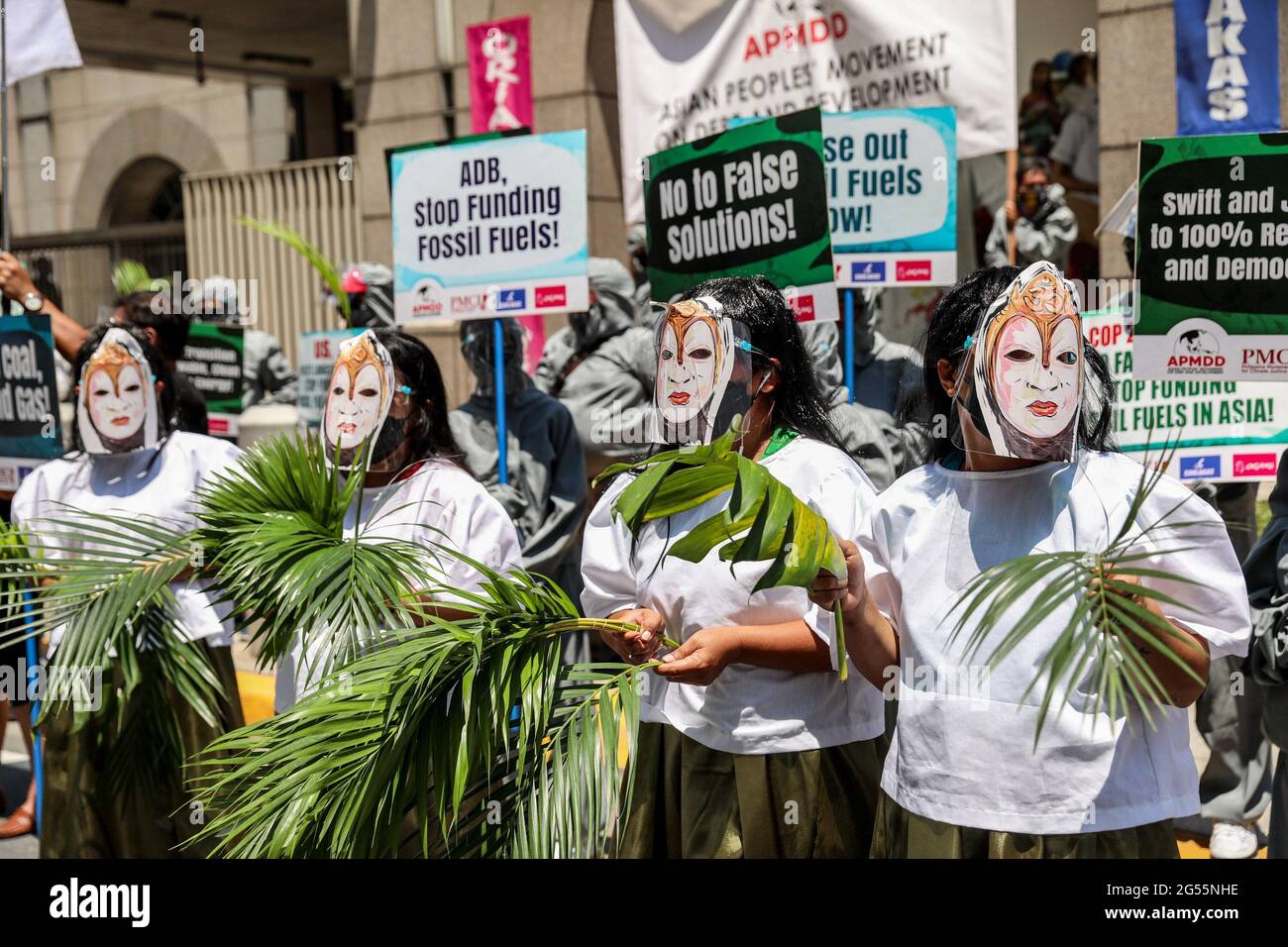 Climate activists dressed in costumes carry signs as they protest ...