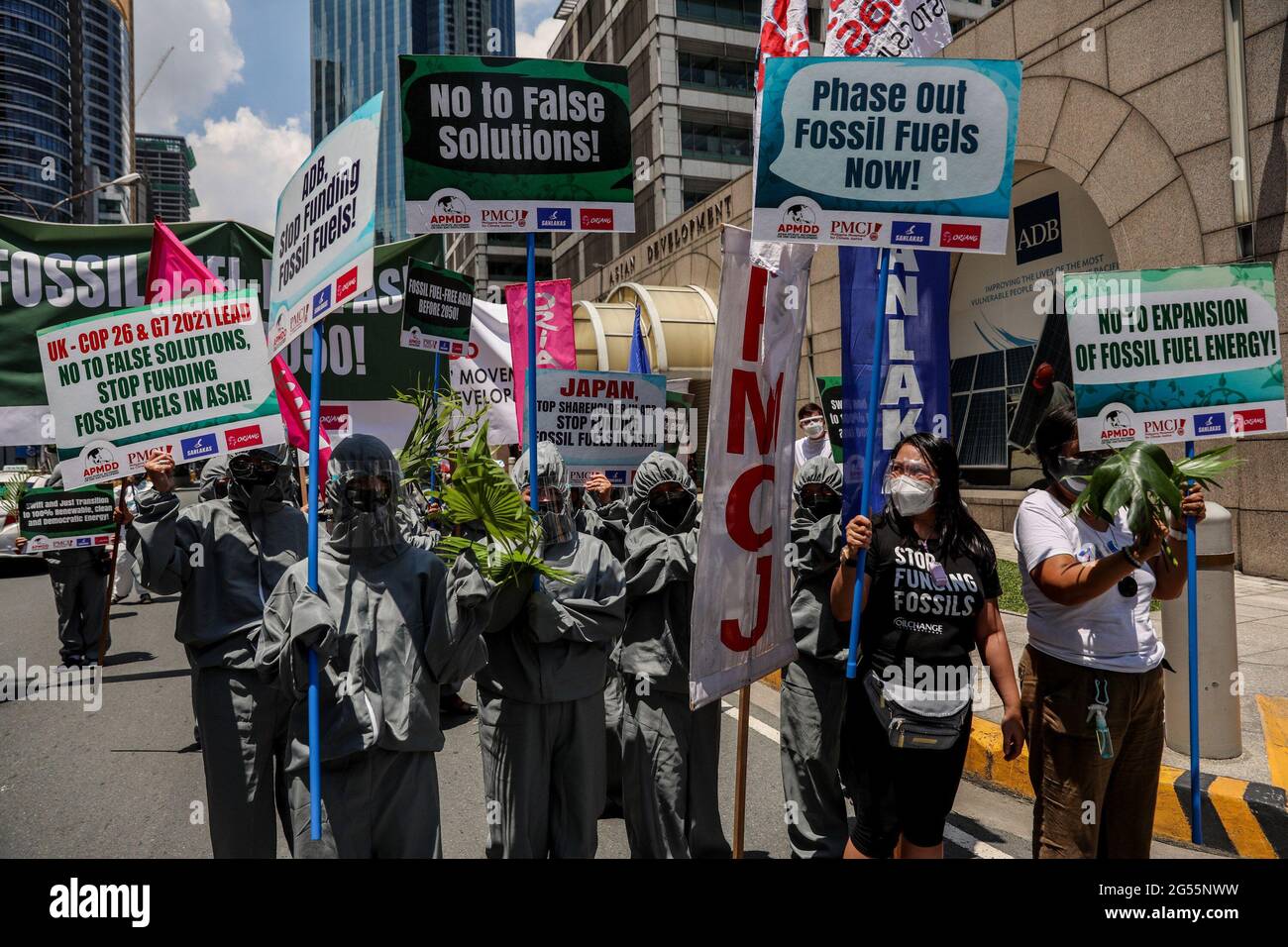 Climate Activists Dressed In Ppe Suits Protest Outside The Asian