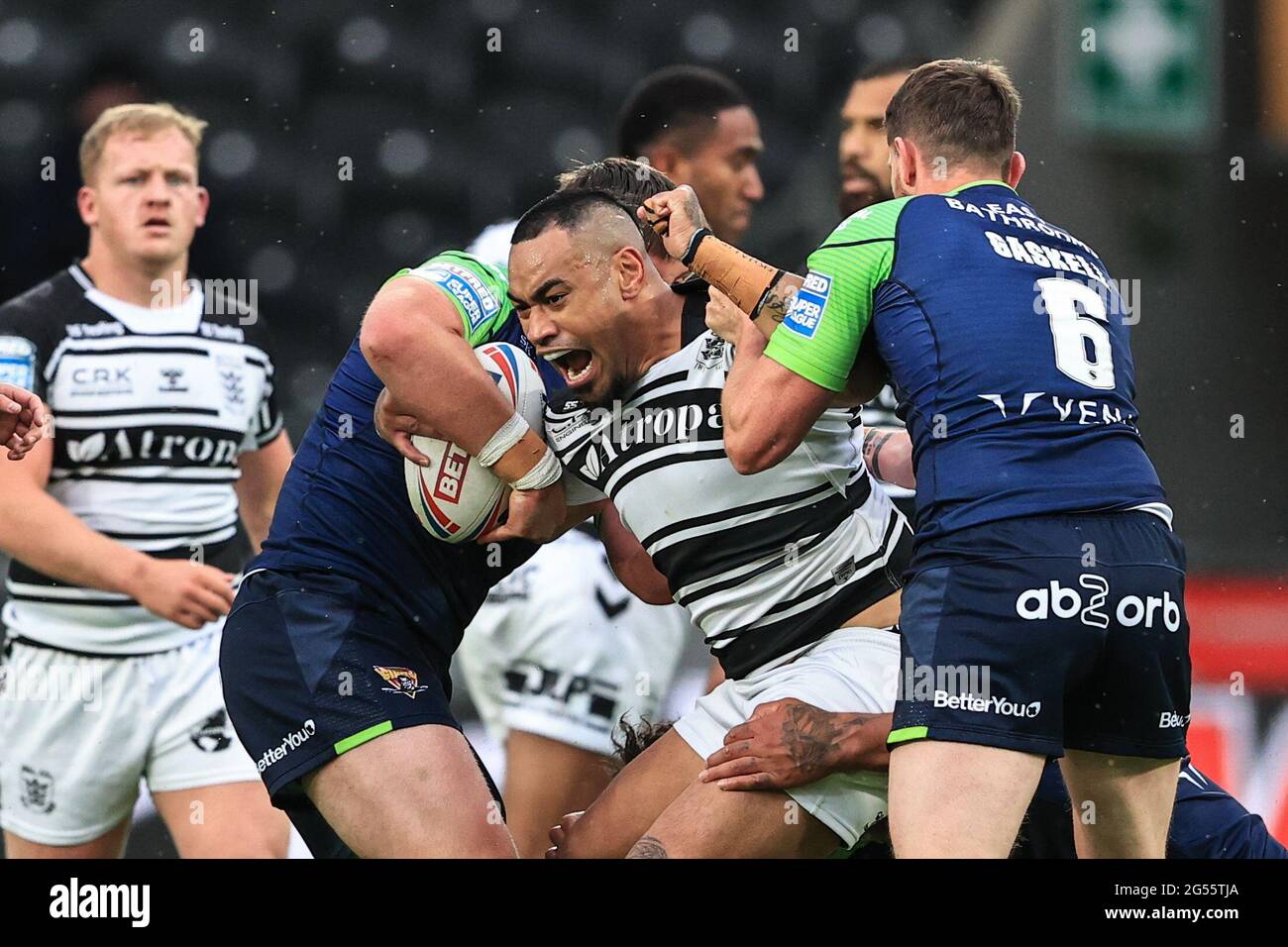 Mahe Fonua (5) of Hull FC is tackled by Joe Greenwood (15) of ...