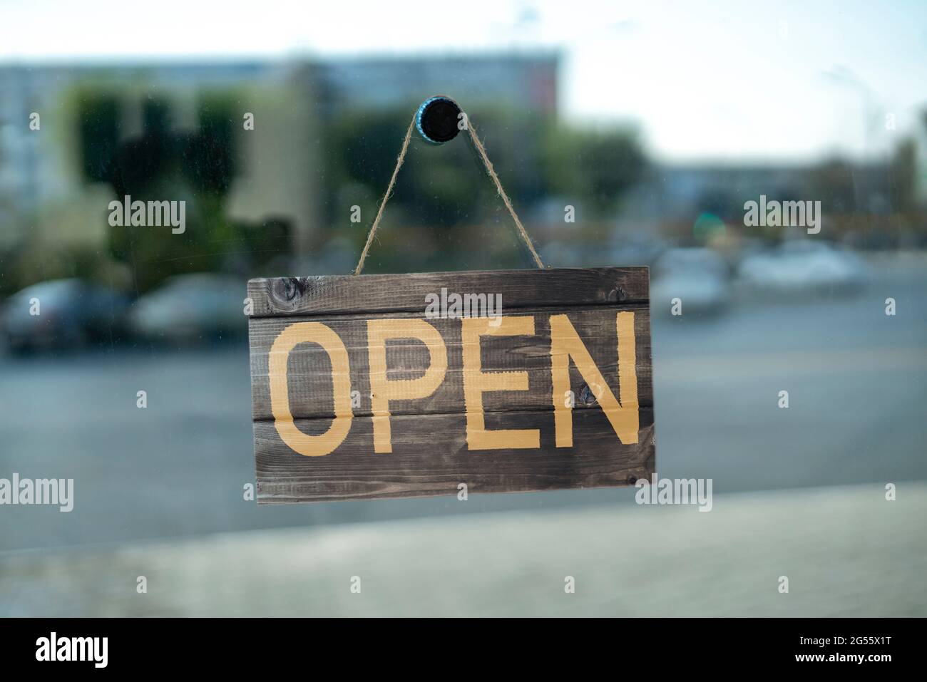 the simple sign board frame hanging on the wall of the building ...