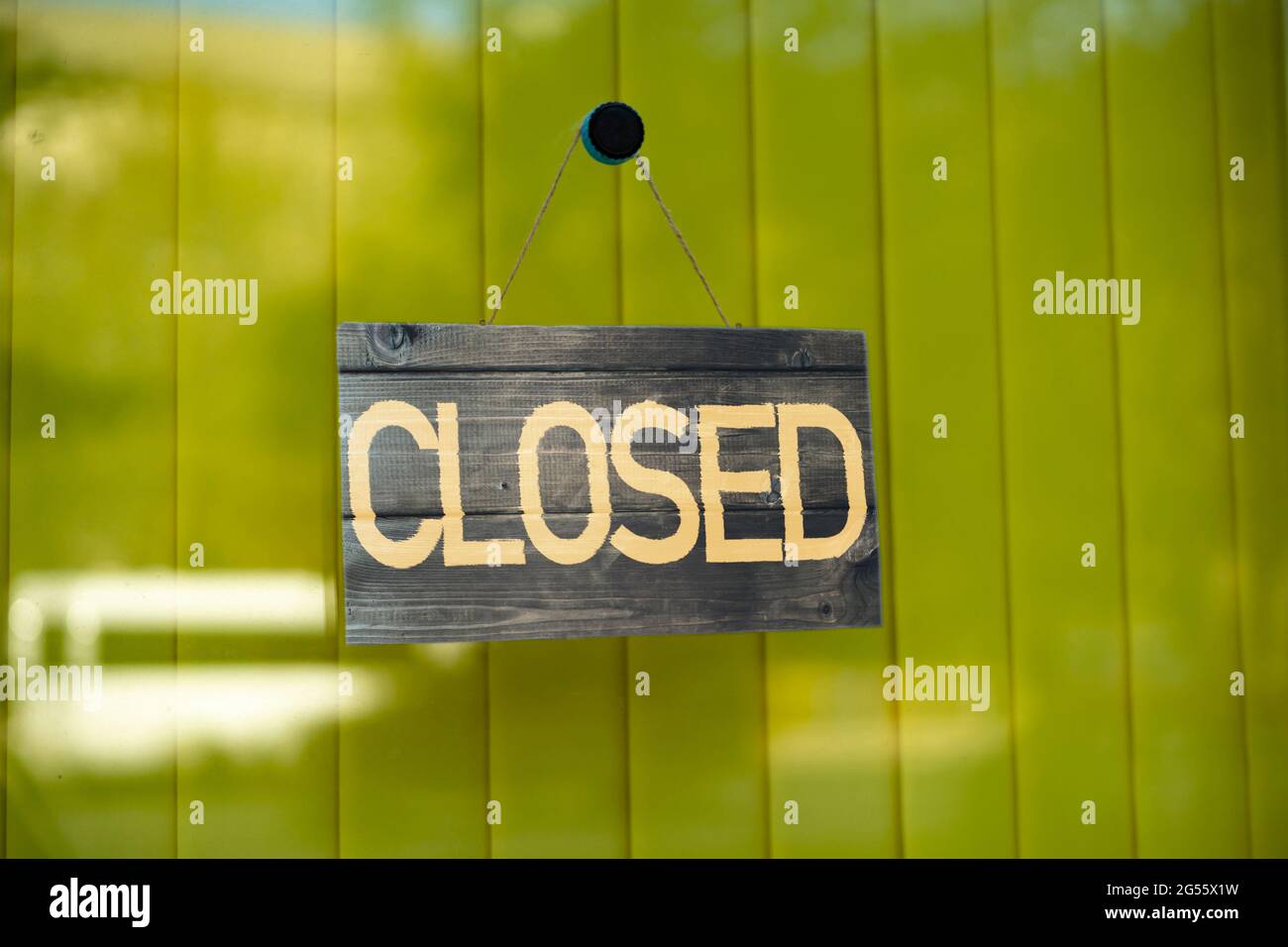 the simple sign board frame hanging on the wall of the building ...
