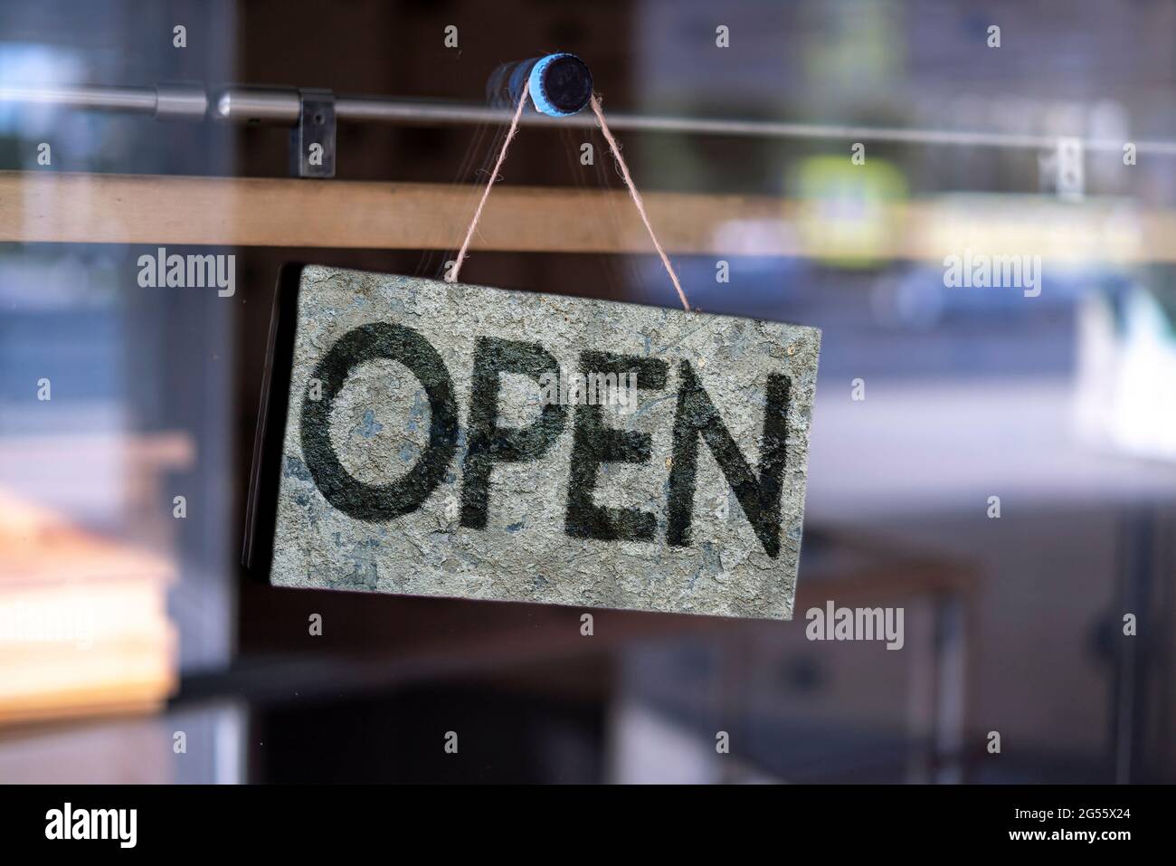the simple sign board frame hanging on the wall of the building ...