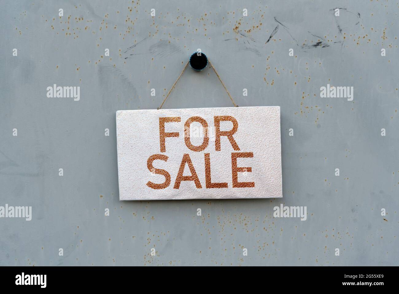 simple sign board frame hanging on the wall of the resident building ...