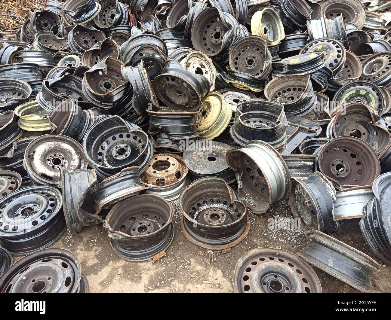 old car alloy wheels on the quay of the port prepared for ...