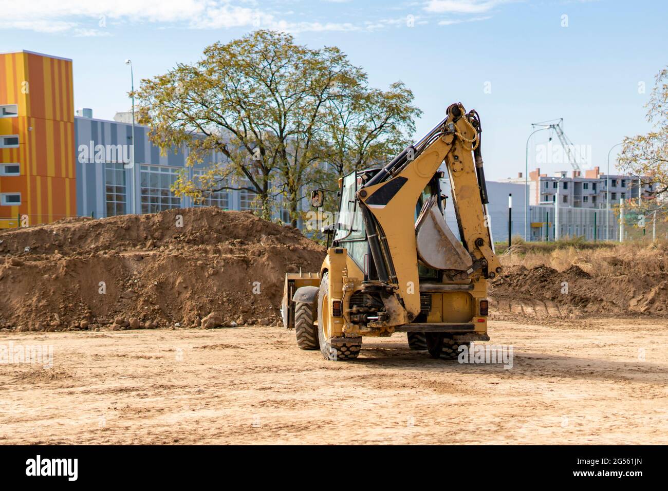 the excavator bulldozer machine working to build the new apartment ...