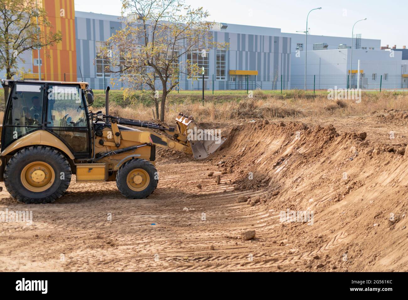 the excavator bulldozer machine working to build the new apartment ...