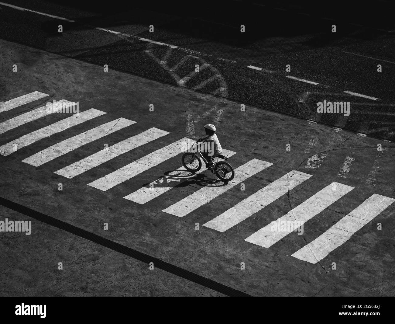 cycling kid on zebra, street in the city Stock Photo - Alamy