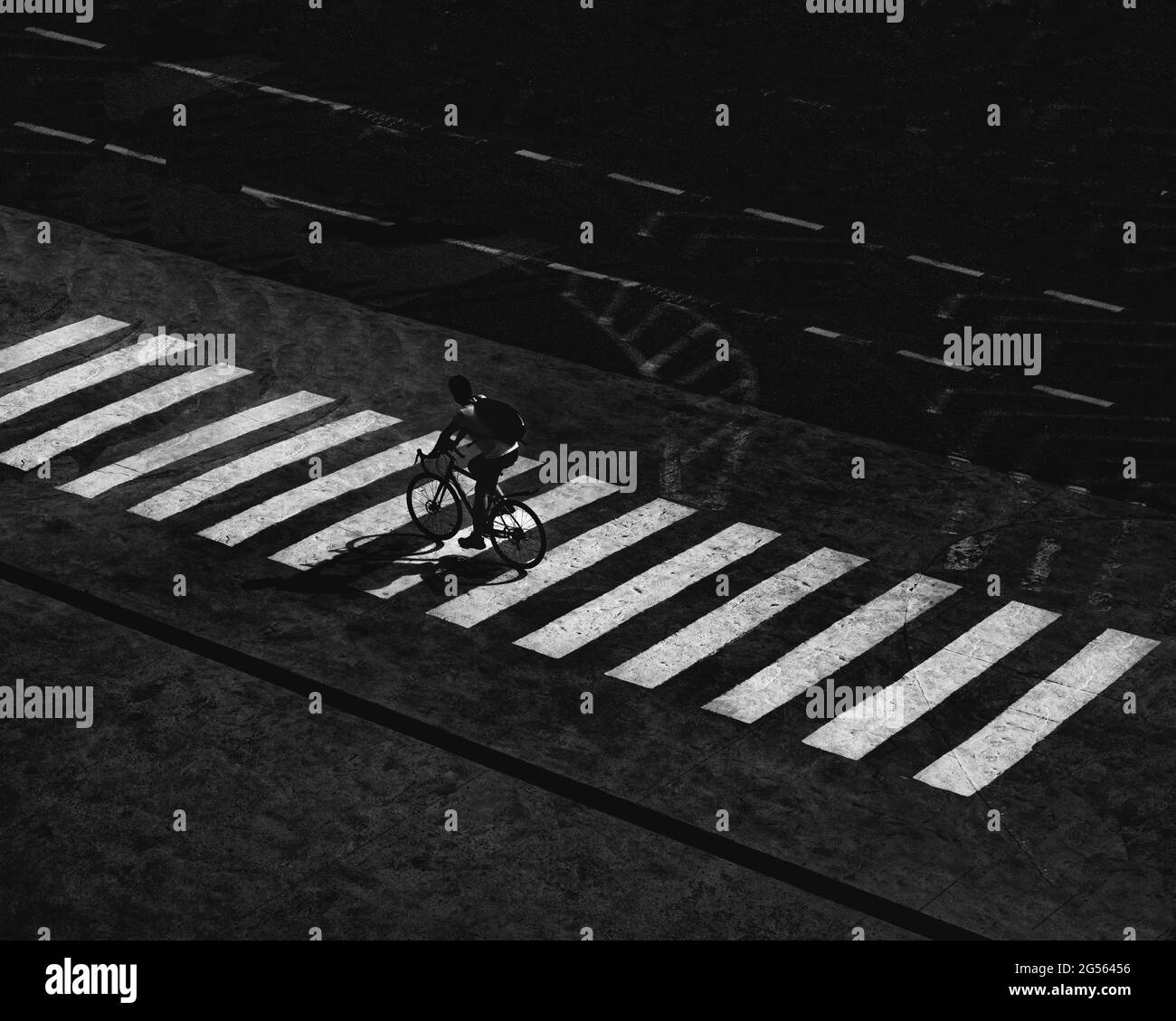 cyclist on zebra crossing Stock Photo - Alamy