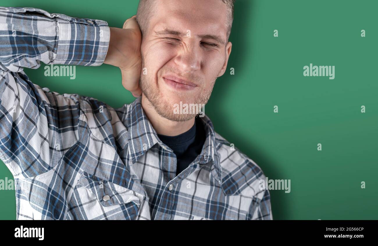 stop that noise! the male feels bad and closes his ear with his hands ...