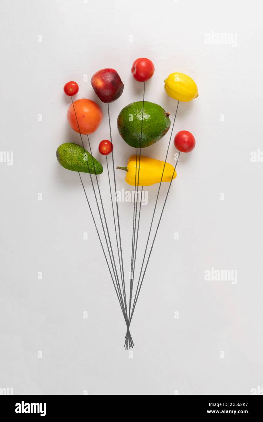 creative concept of mix of bunch of fruit fly in the air like balloon ...