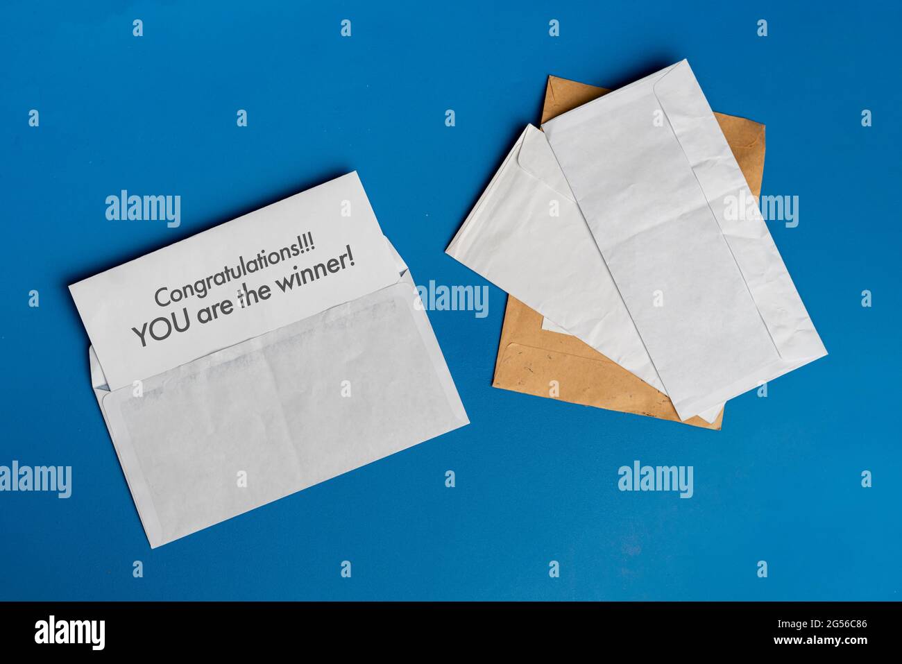 opened envelope with a paper inside with a text "you are winner ...