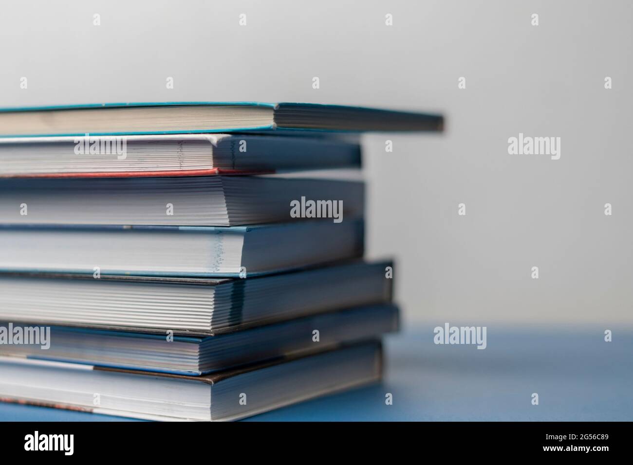 a simple stack of books on the shelf at home Stock Photo - Alamy