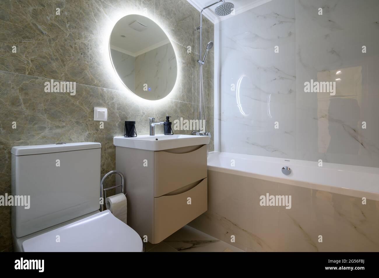 Compact modern luxury marble bathroom Stock Photo - Alamy