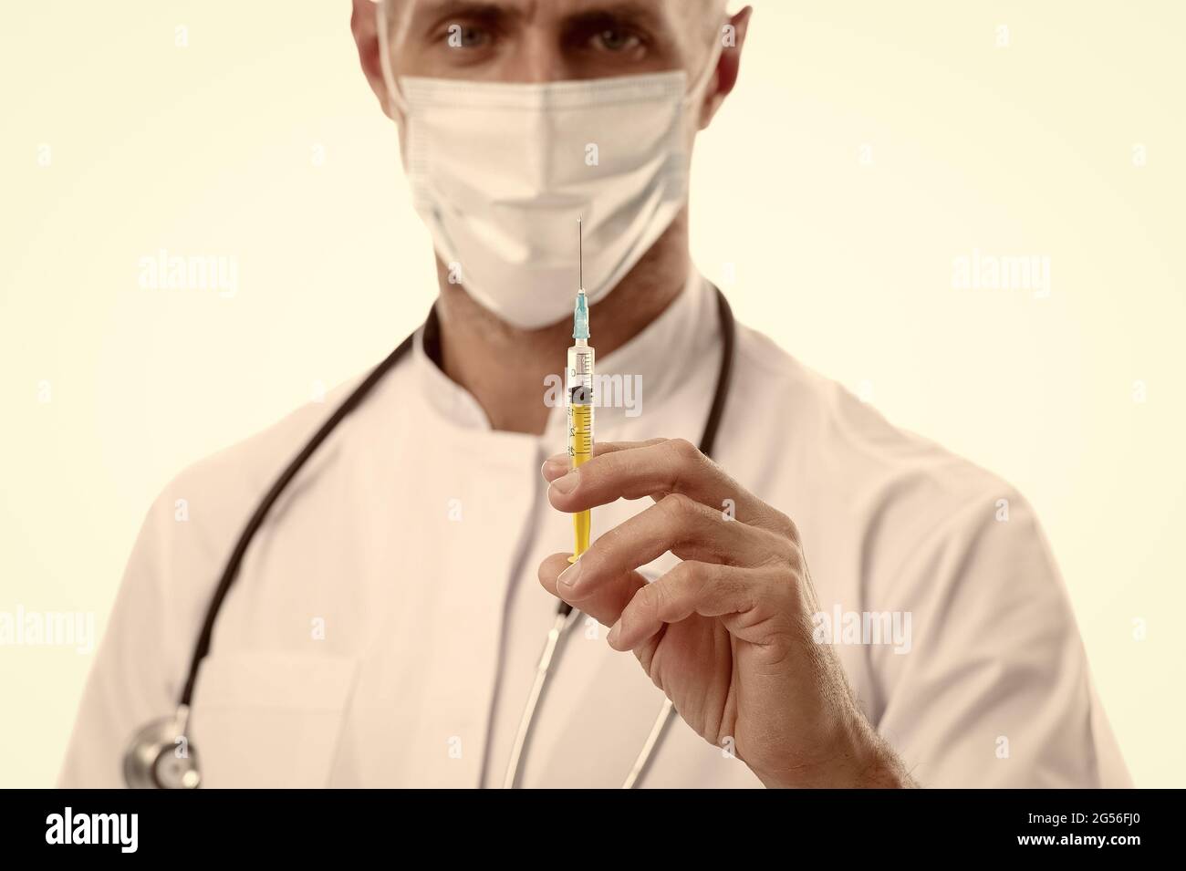 Doctor hold syringe. Giving injection. Covid-19 prevention. Injection ...