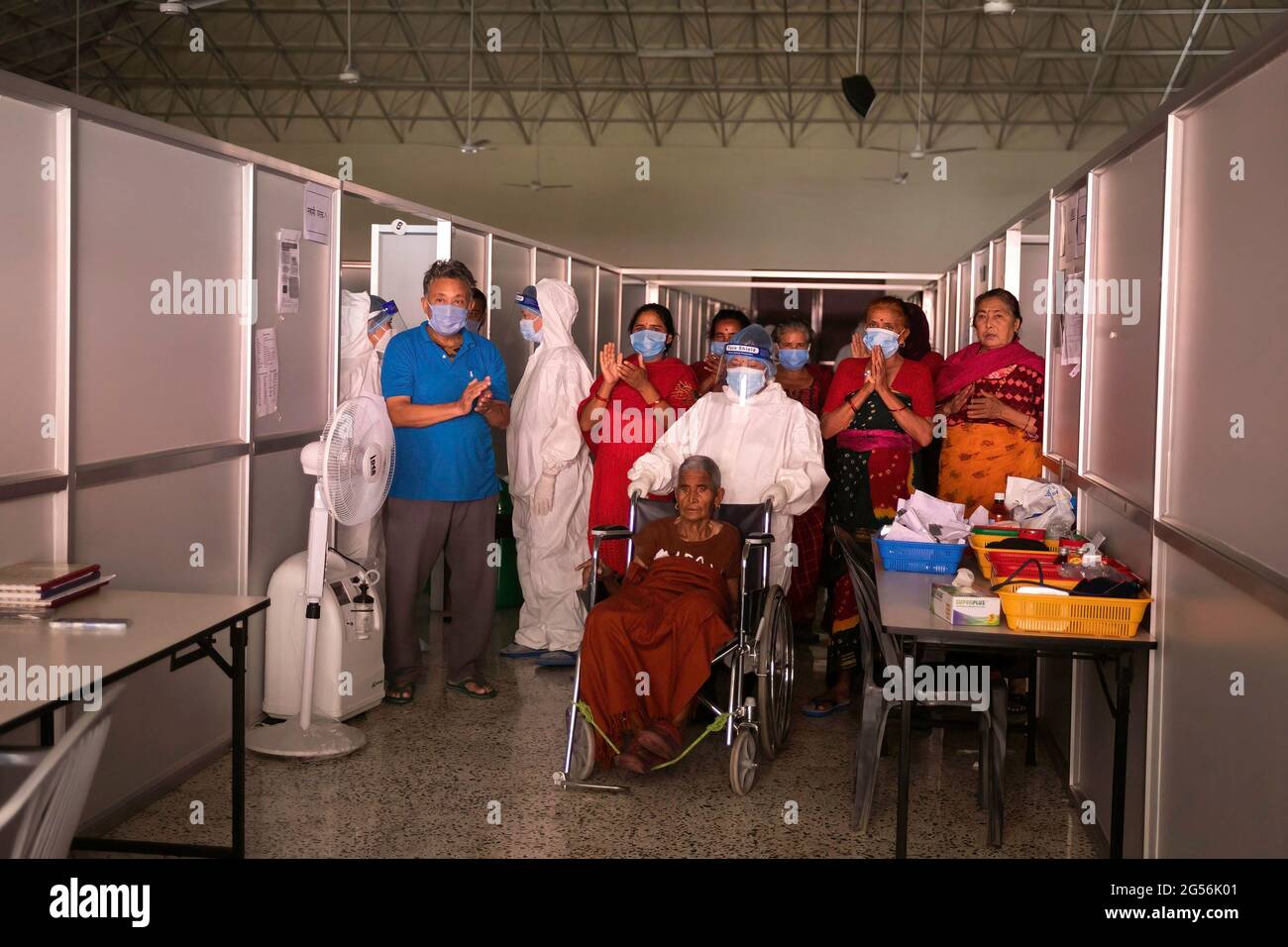 Frontline heath workers bid farewell to 94 years old Kalika Devi Bastola after she won the ...