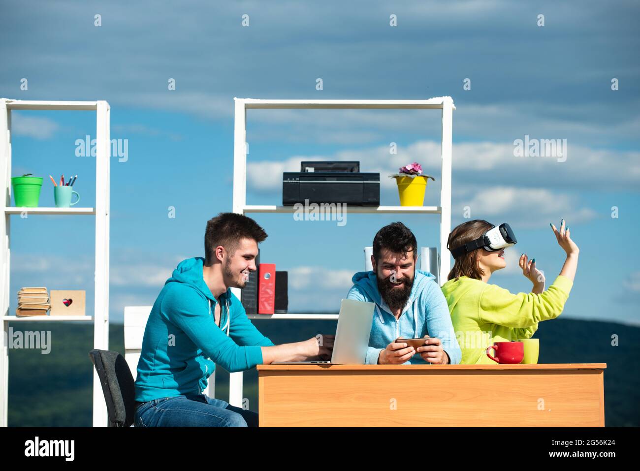 Team of young business people wearing vr headsets, working with new ...