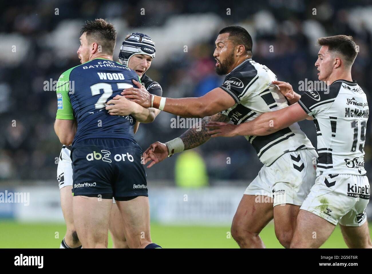 Aiden Burrell (31) of Hull FC tackles Sam Wood (27) of Huddersfield ...