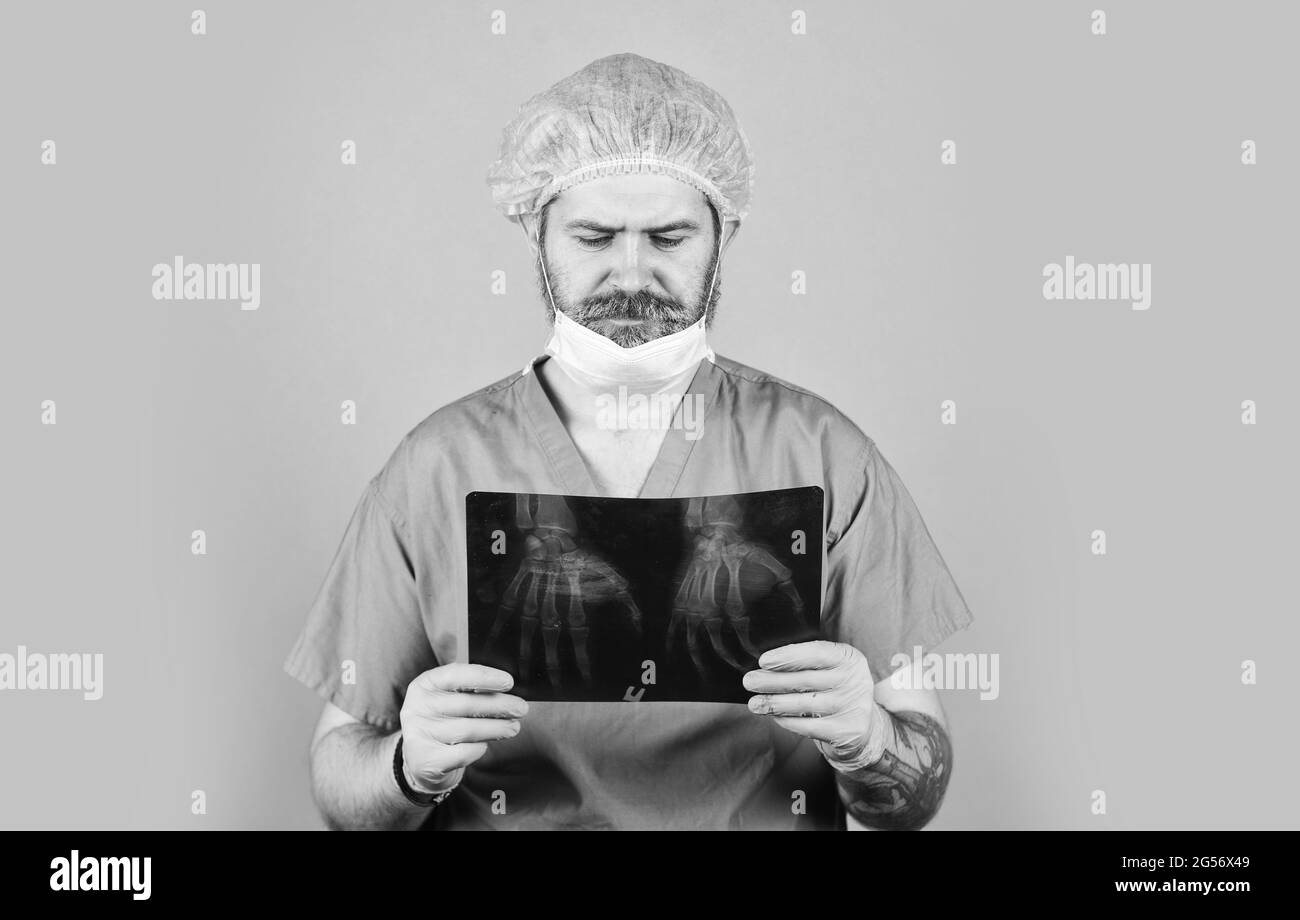 man look at roentgen. Radiologist hold xray. doctor examines ...